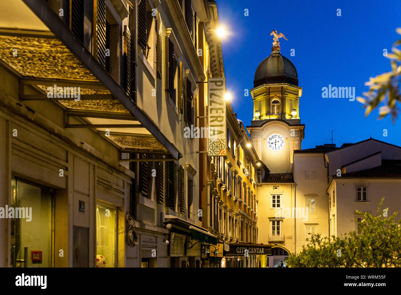 An evening view of the The Baroque Rijeka city clock tower as seen from ...