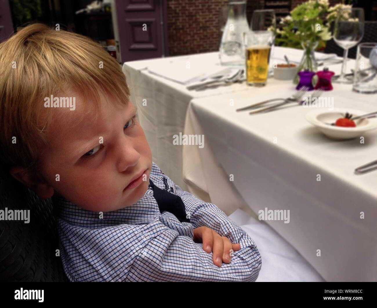 Angry boy arms crossed hi-res stock photography and images - Alamy