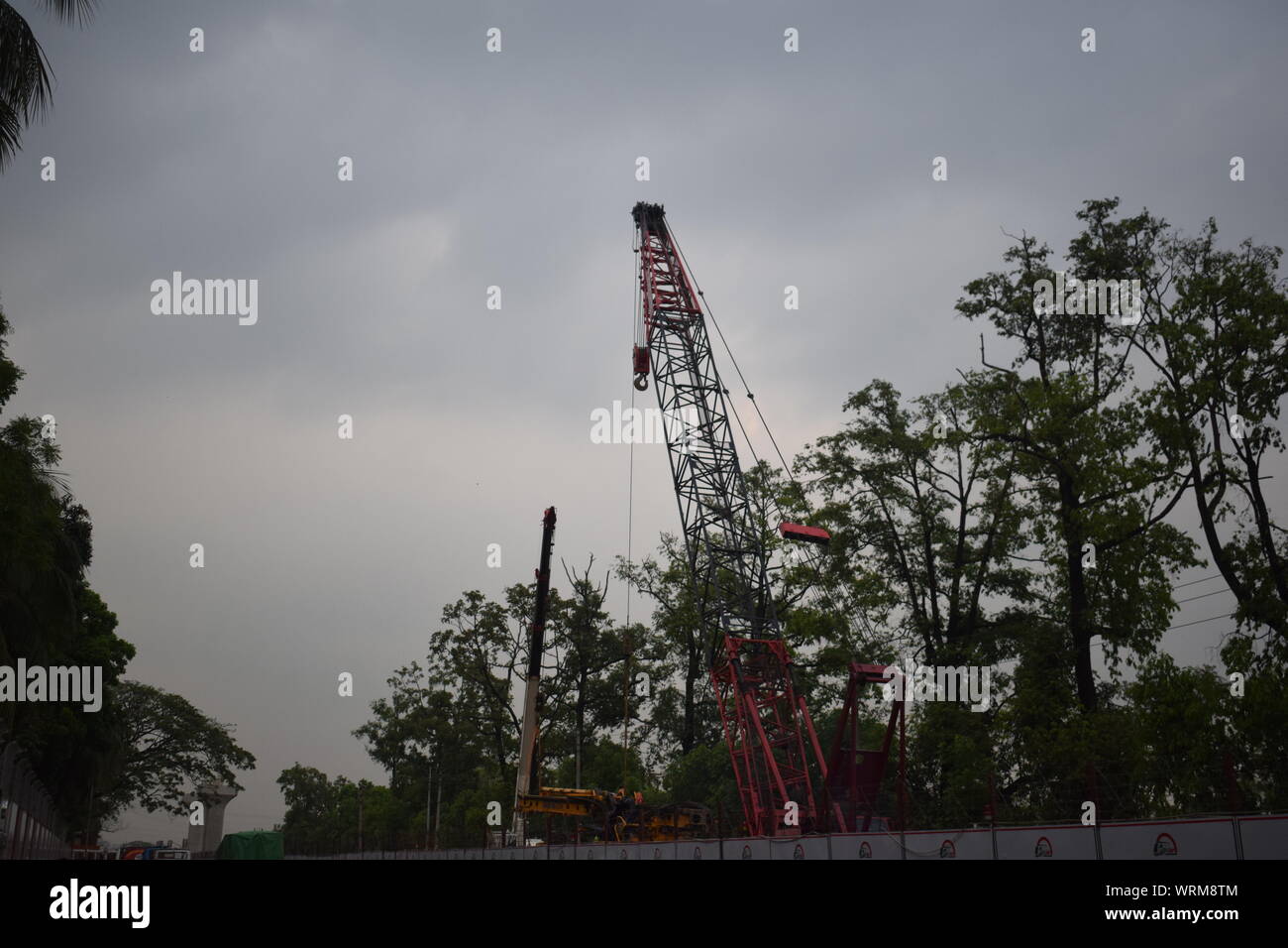 Metro rail construction site with huge size crane Stock Photo - Alamy