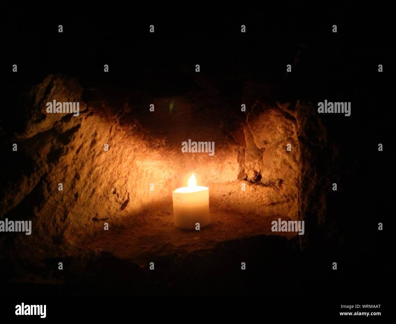 Close-up Of A Burning Candle In The Corner Stock Photo - Alamy