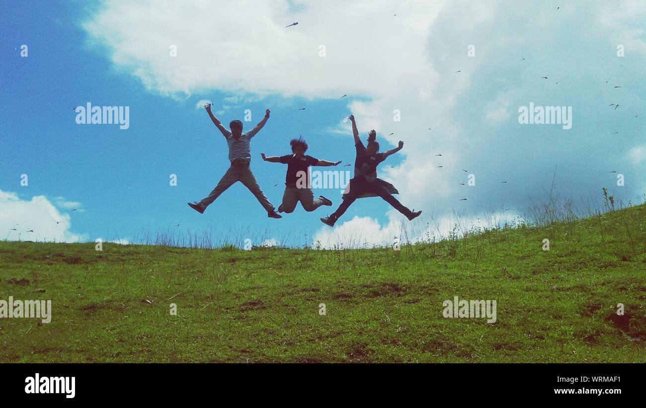 Group children jumping hi-res stock photography and images - Alamy