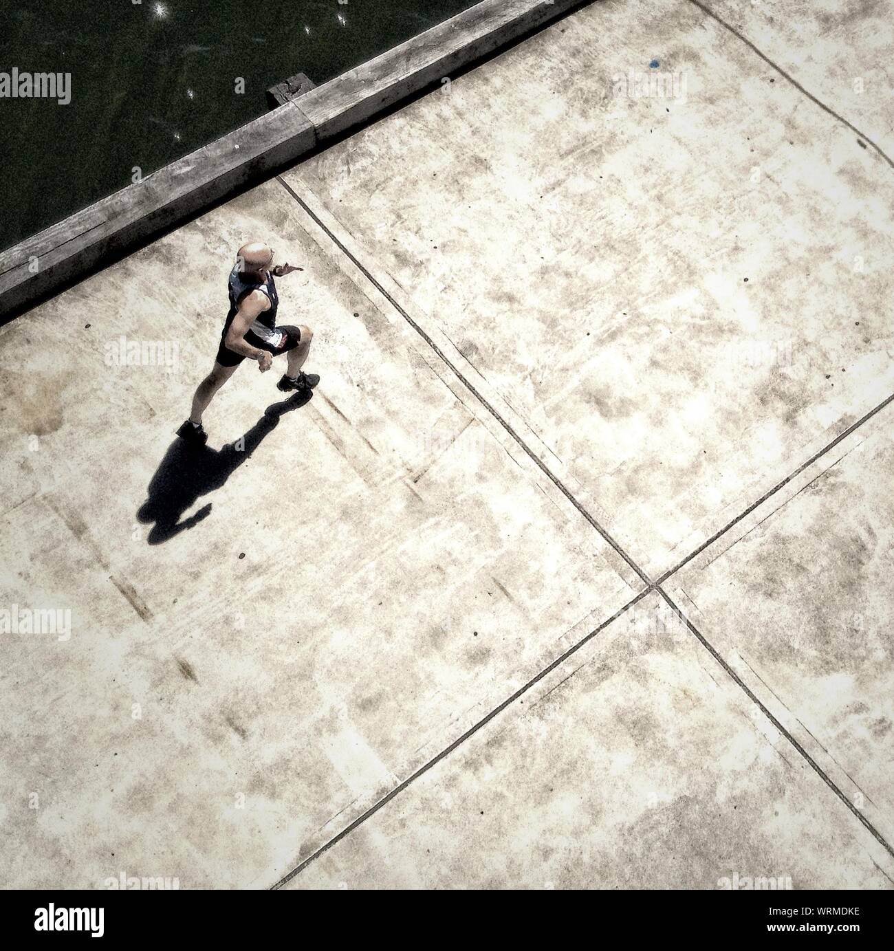 Shadow man running on street hi-res stock photography and images - Alamy