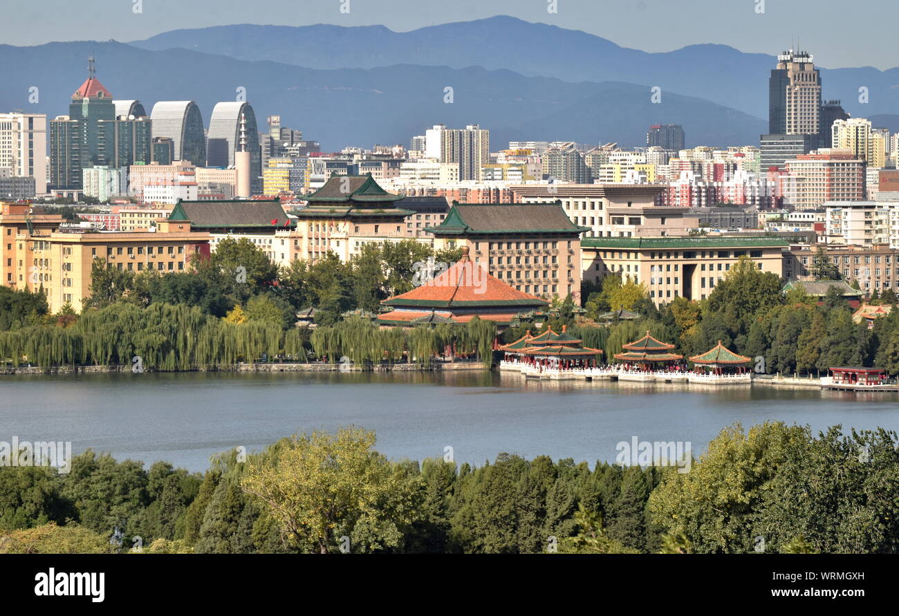 Beijing clean city skyline by Qianhai lake of Beihai park with a ...