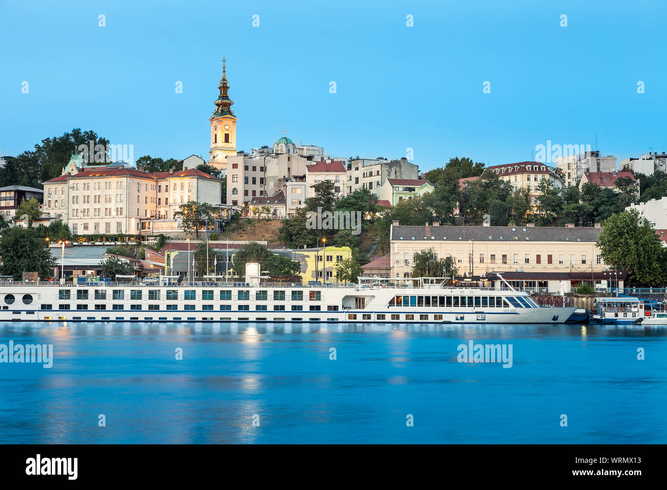 Blue hour view of Belgrade riverfront with Sava river in the foreground ...