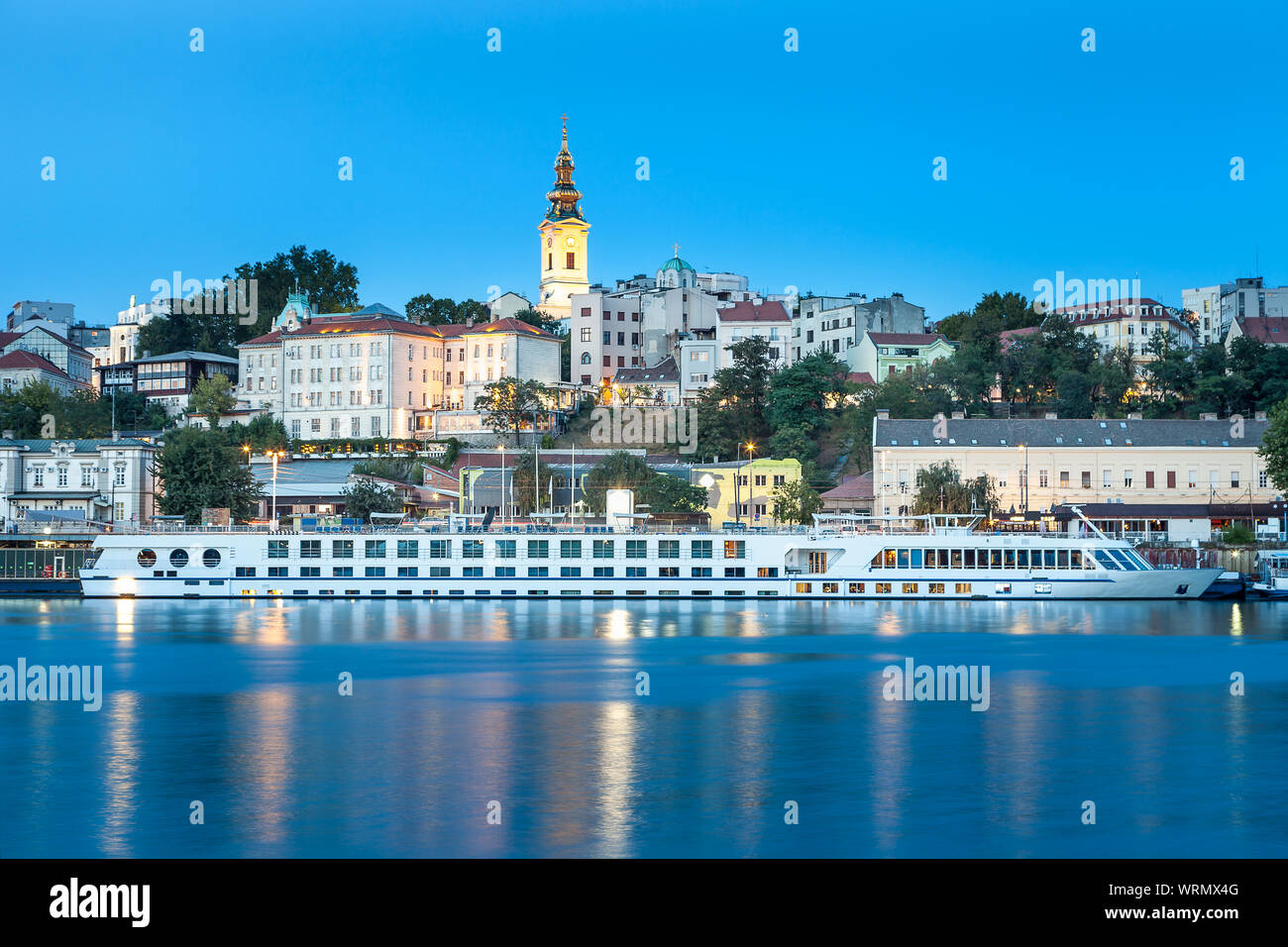 Blue hour view of Belgrade riverfront with Sava river in the foreground ...