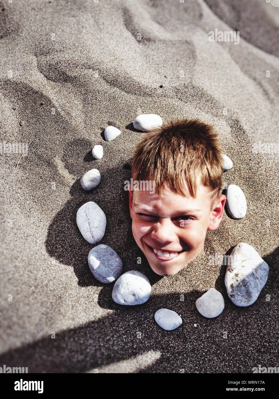 Boy in sand at beach hi-res stock photography and images - Alamy