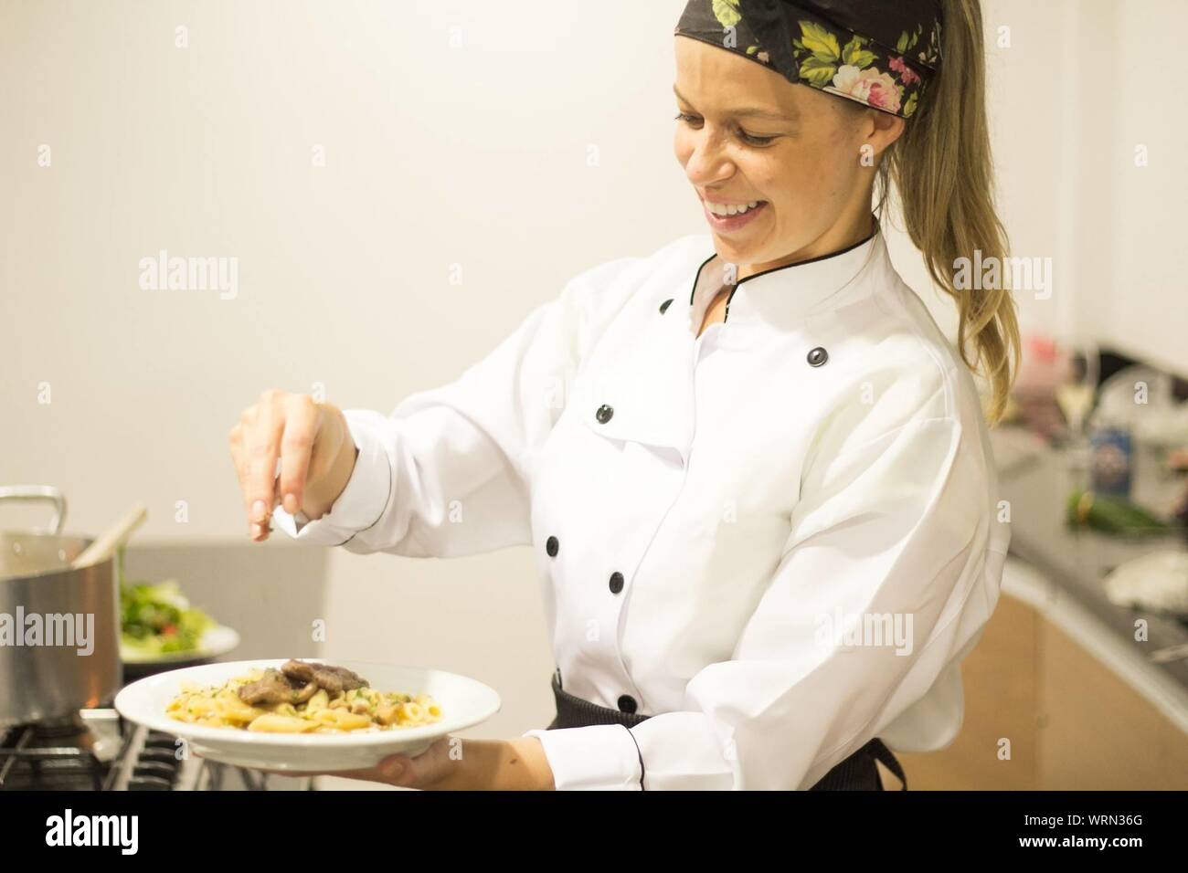 Happy female chef hi-res stock photography and images - Alamy