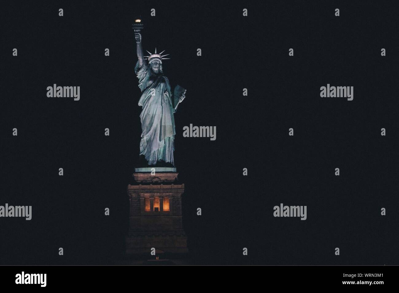 Statue liberty illuminated night hi-res stock photography and images ...