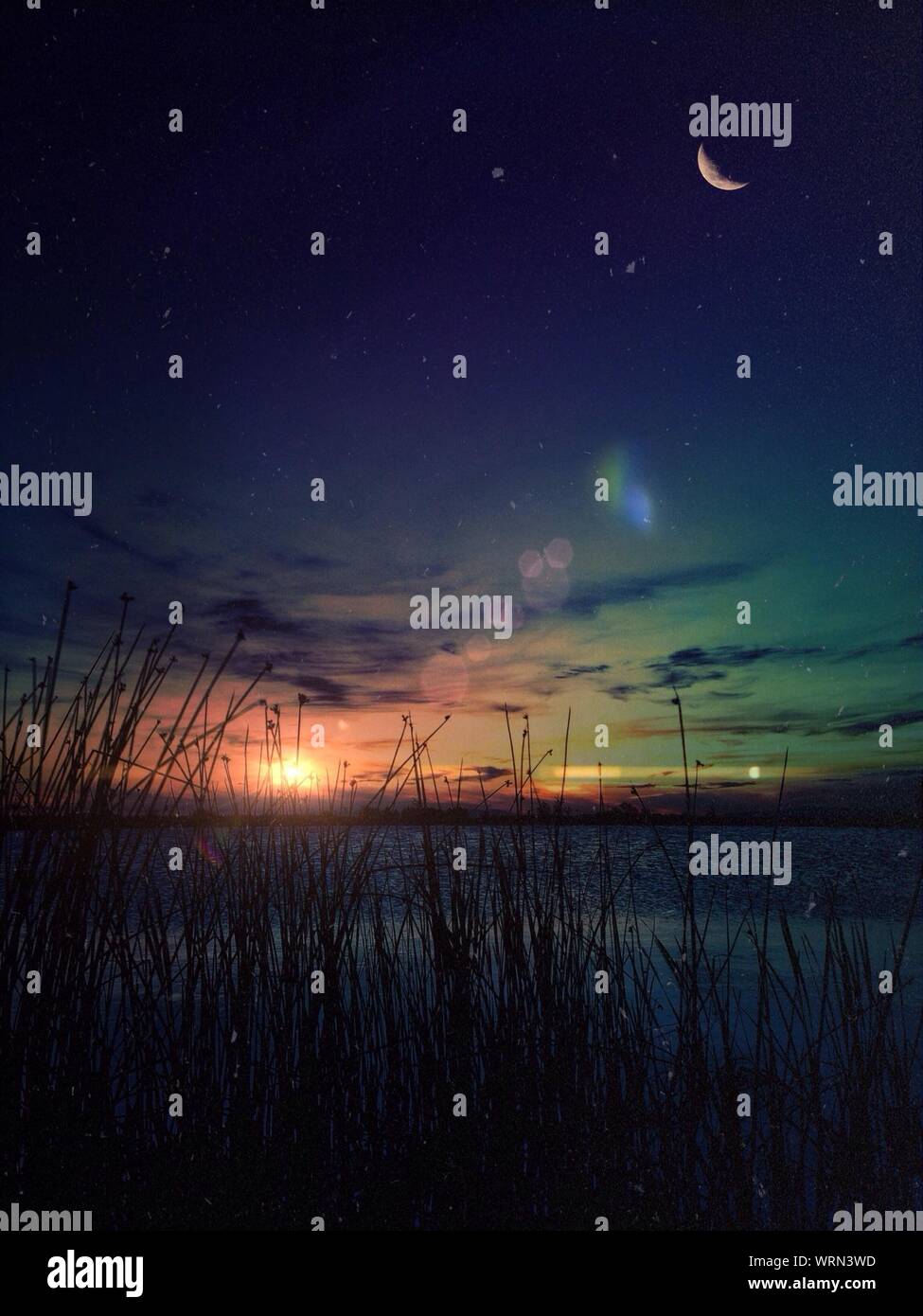 Moon in sunset hi-res stock photography and images - Alamy