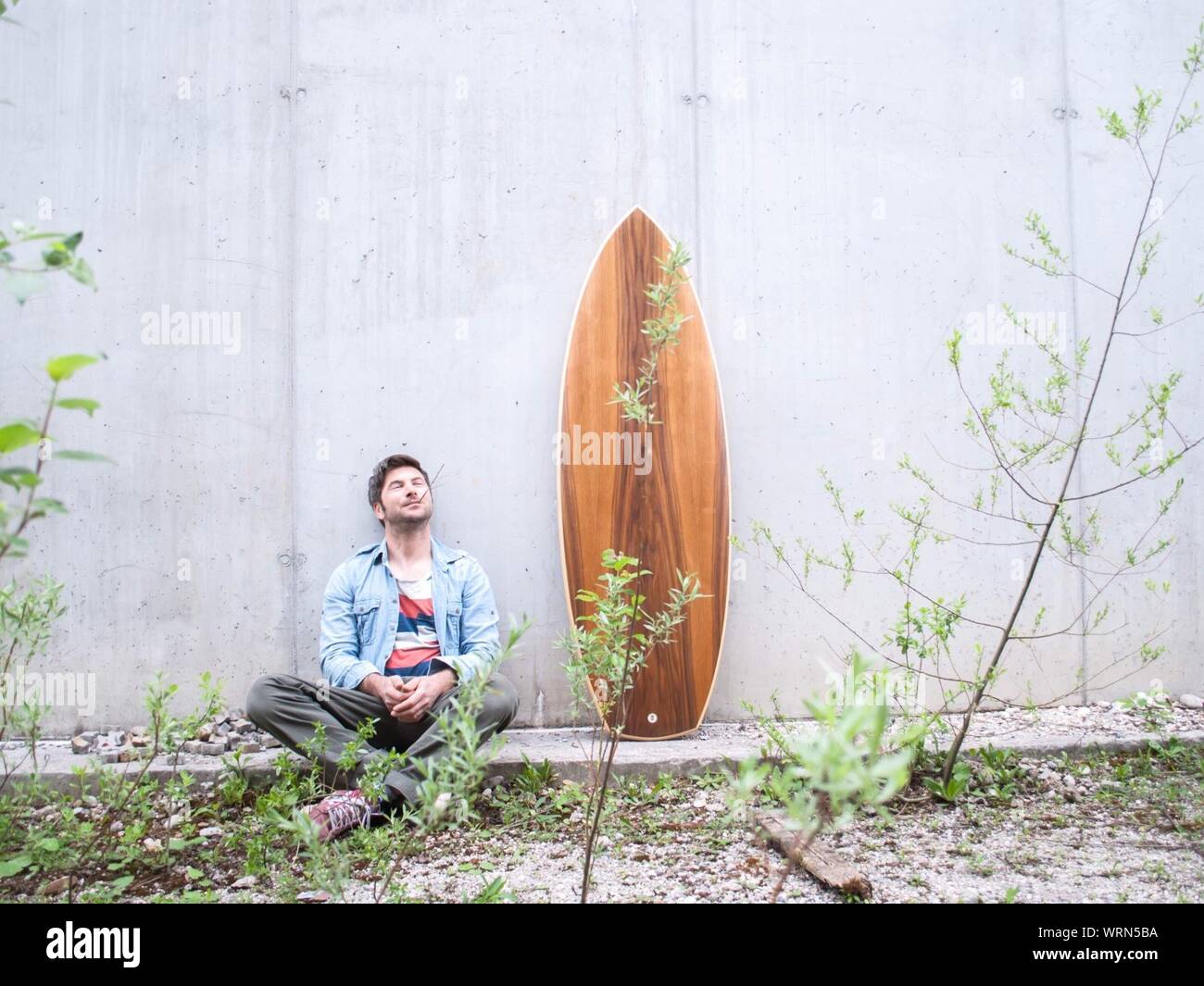 Man resting wall hi-res stock photography and images - Alamy