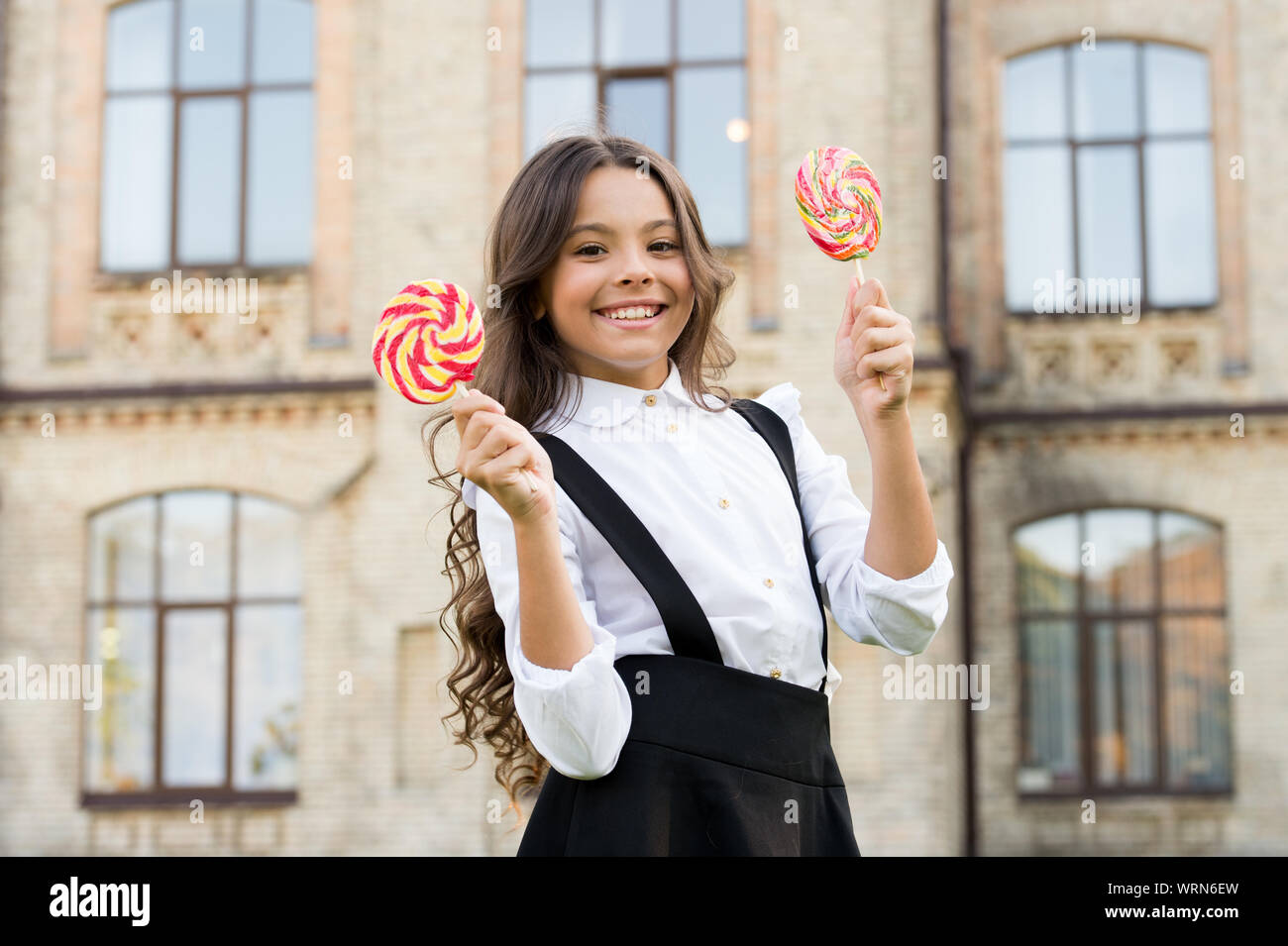 Picking flavour is hardest part. Schoolgirl choosing sweets. Happy kid ...