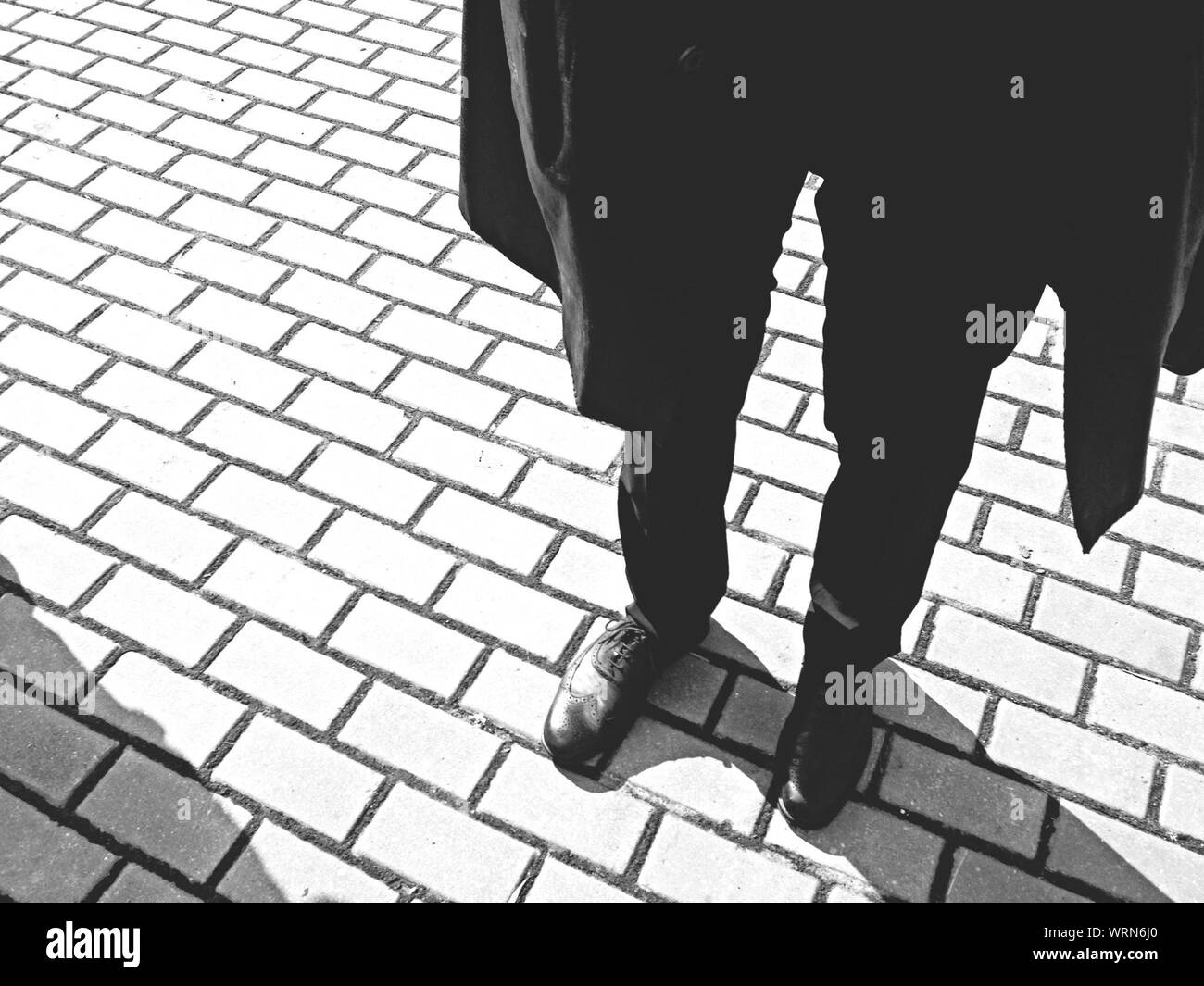 Man on ground on footpath hi-res stock photography and images - Alamy