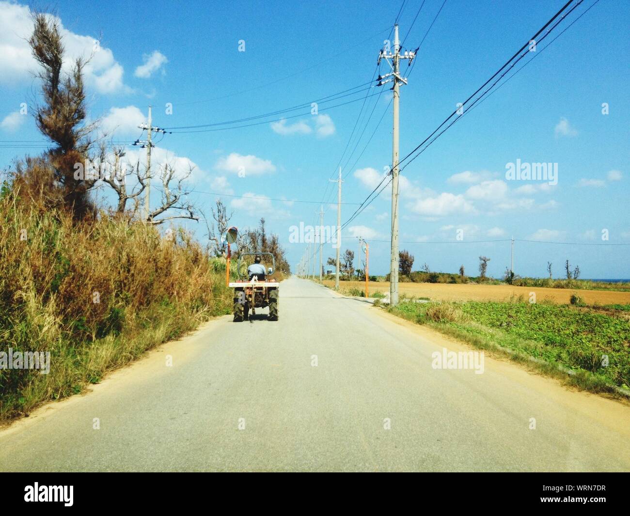 Man driving blue tractor hi-res stock photography and images - Alamy