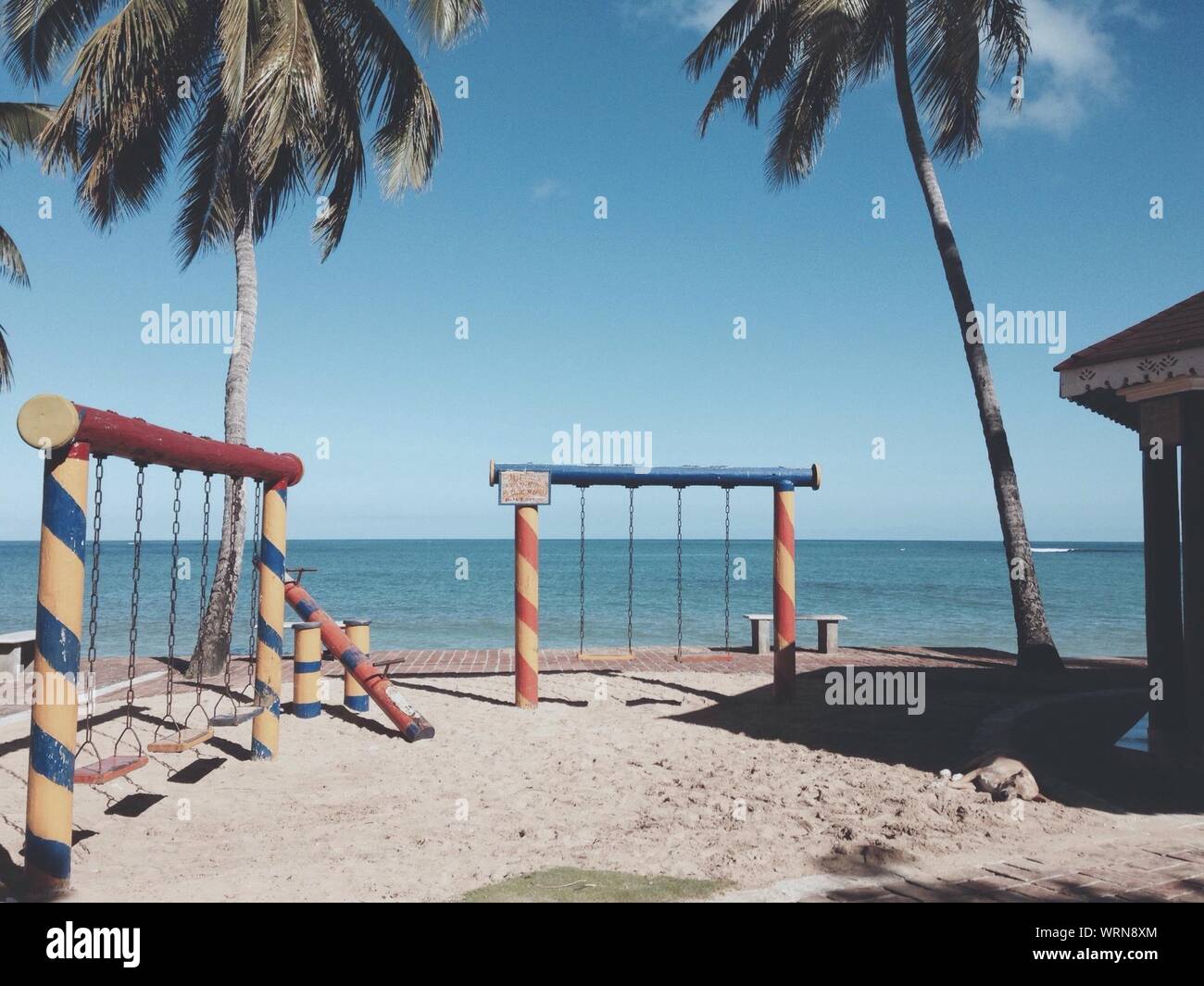 Swings on a beach hi-res stock photography and images - Alamy