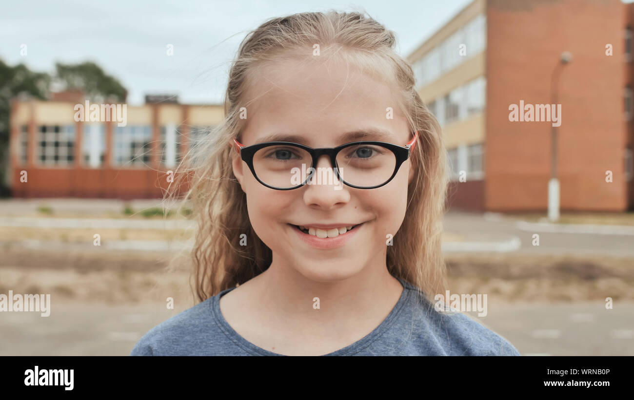 Portrait of a young smiling 11 year old girl with glasses Stock Photo ...