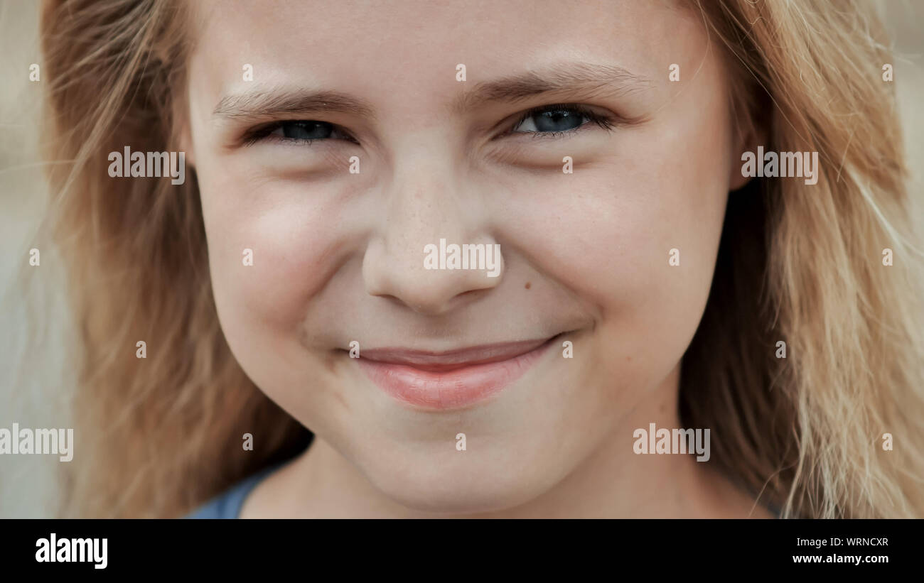 Portrait of a young smiling 11 year old girl. Face close up Stock Photo - Alamy