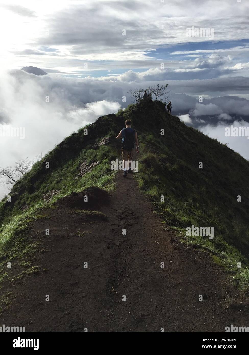 Man walking up mountain hi-res stock photography and images - Alamy
