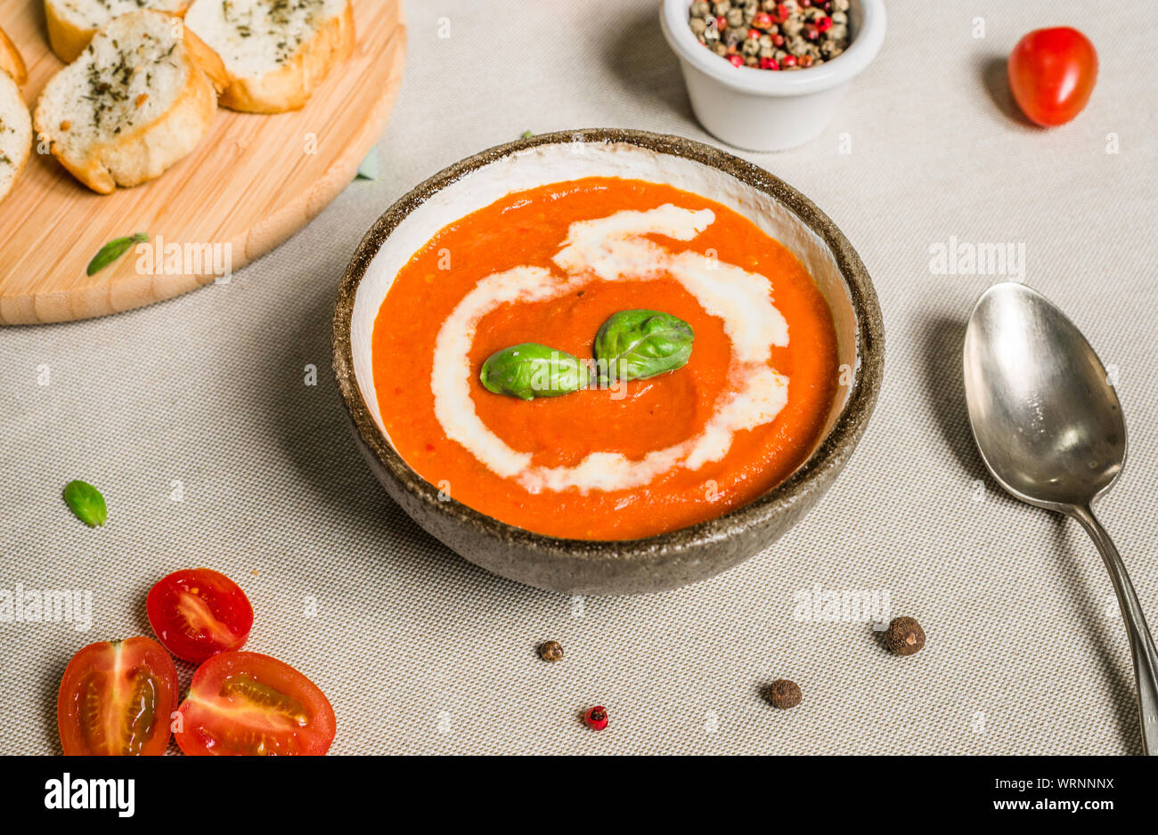 Colorful cream of tomato soup against white background. Healthy food ...
