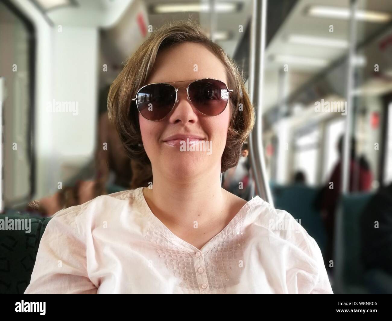 Woman sitting in train hi-res stock photography and images - Alamy