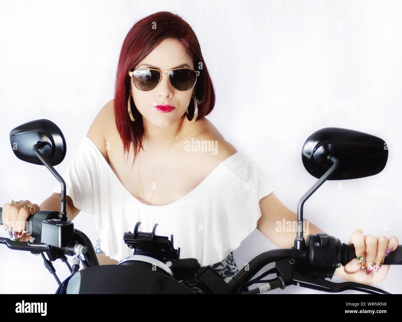 Young woman driving motorcycle hi-res stock photography and images - Alamy