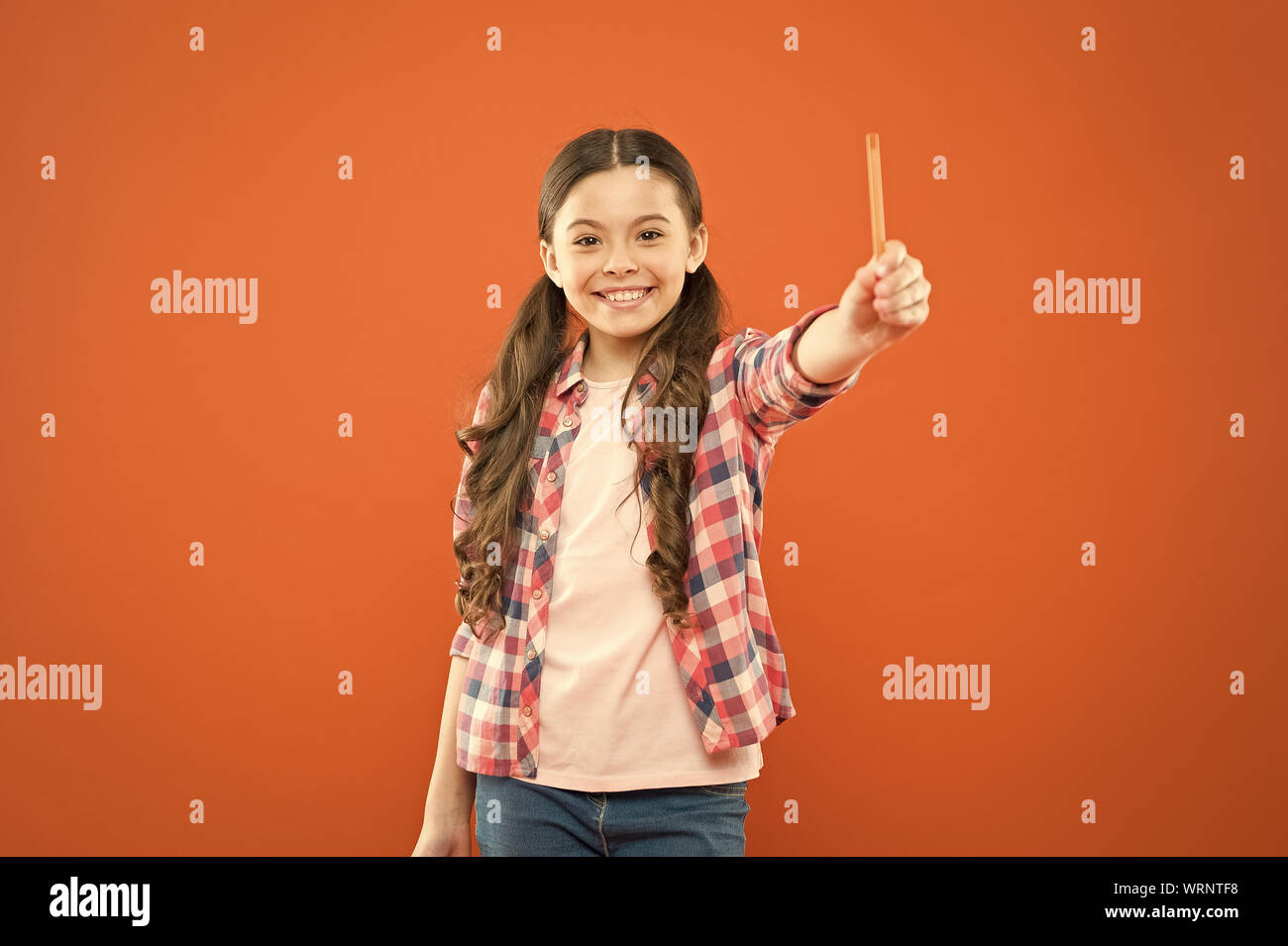 Take my writing pen. Happy school child enjoy her writing skills ...