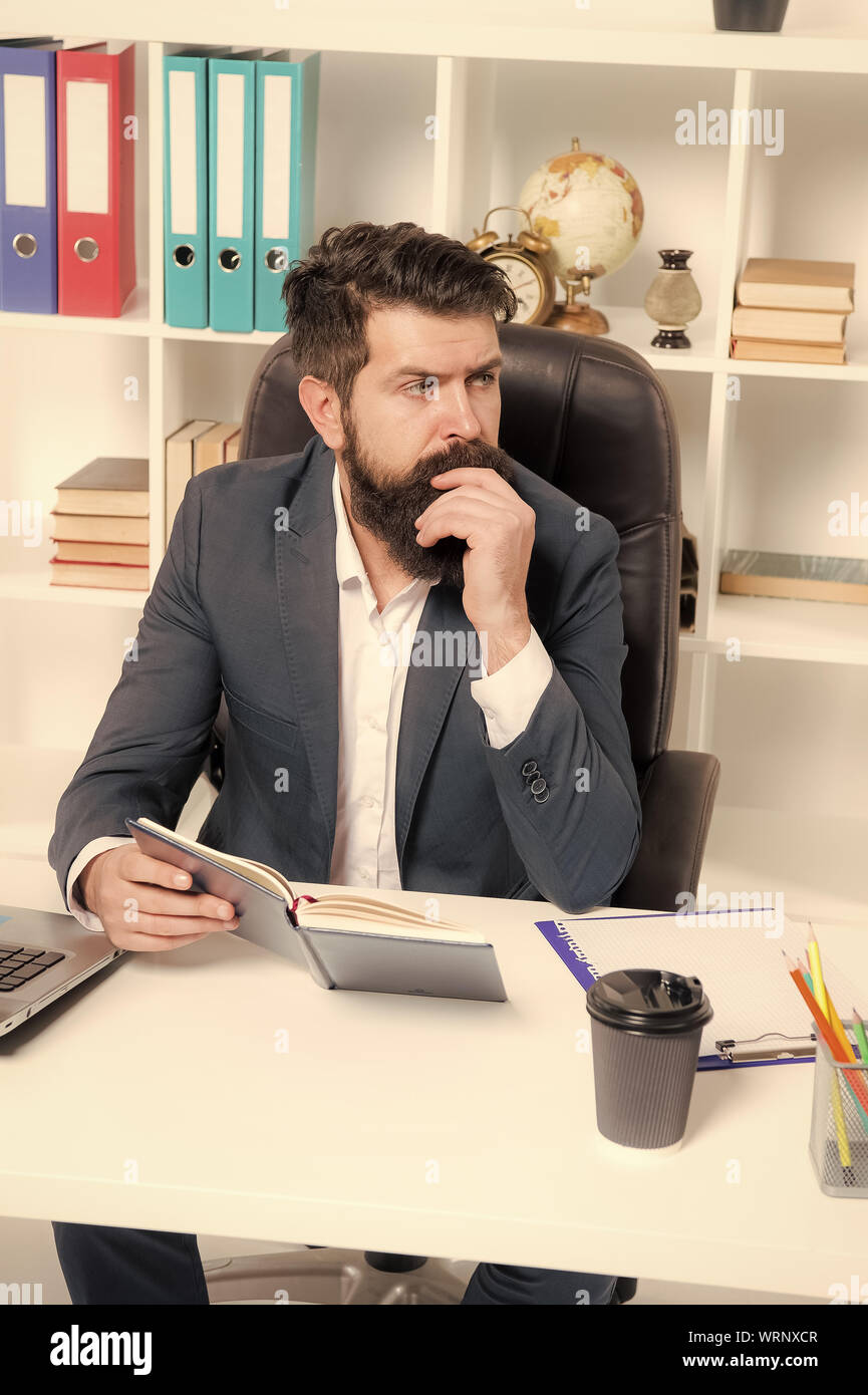 Busy boss in office. Check if i have time today. Man bearded hipster ...