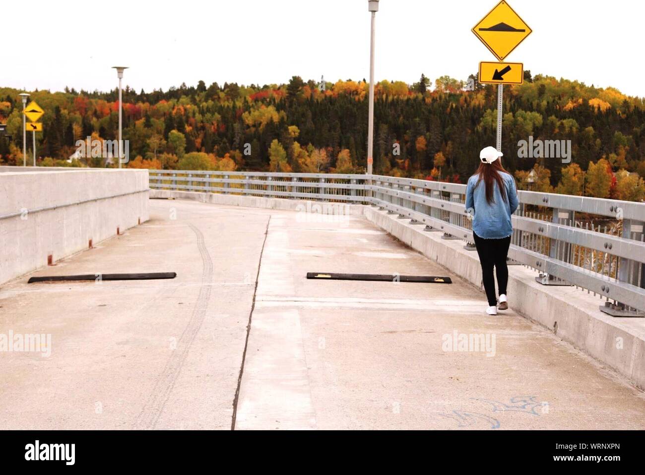 Woman walking railing architecture hi-res stock photography and images ...
