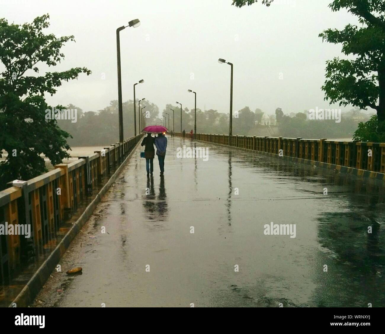 People walking over bridge hi-res stock photography and images - Alamy