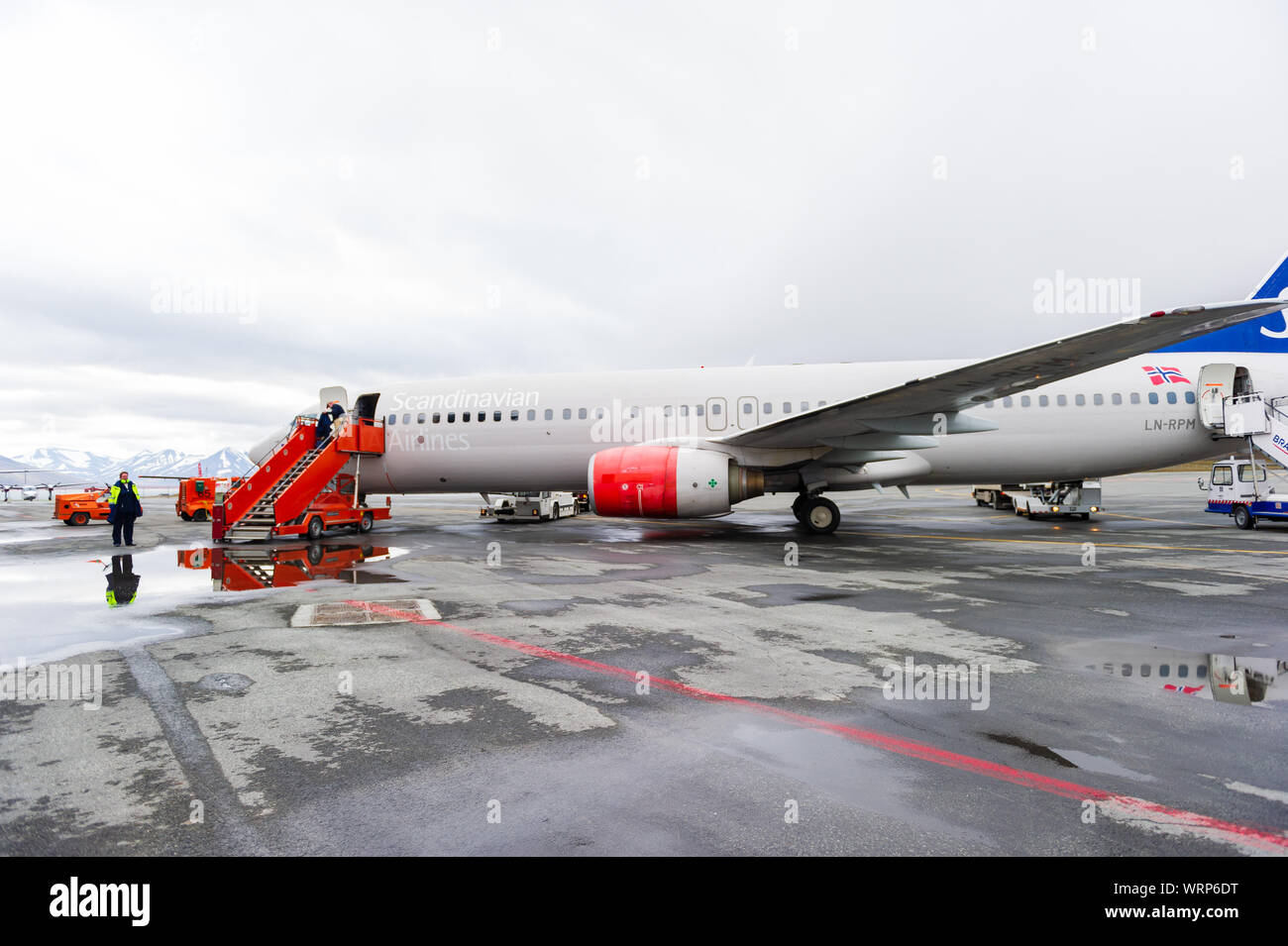 Passengers disembarking a commercial airplane in Longyearbyen, Svalbard ...