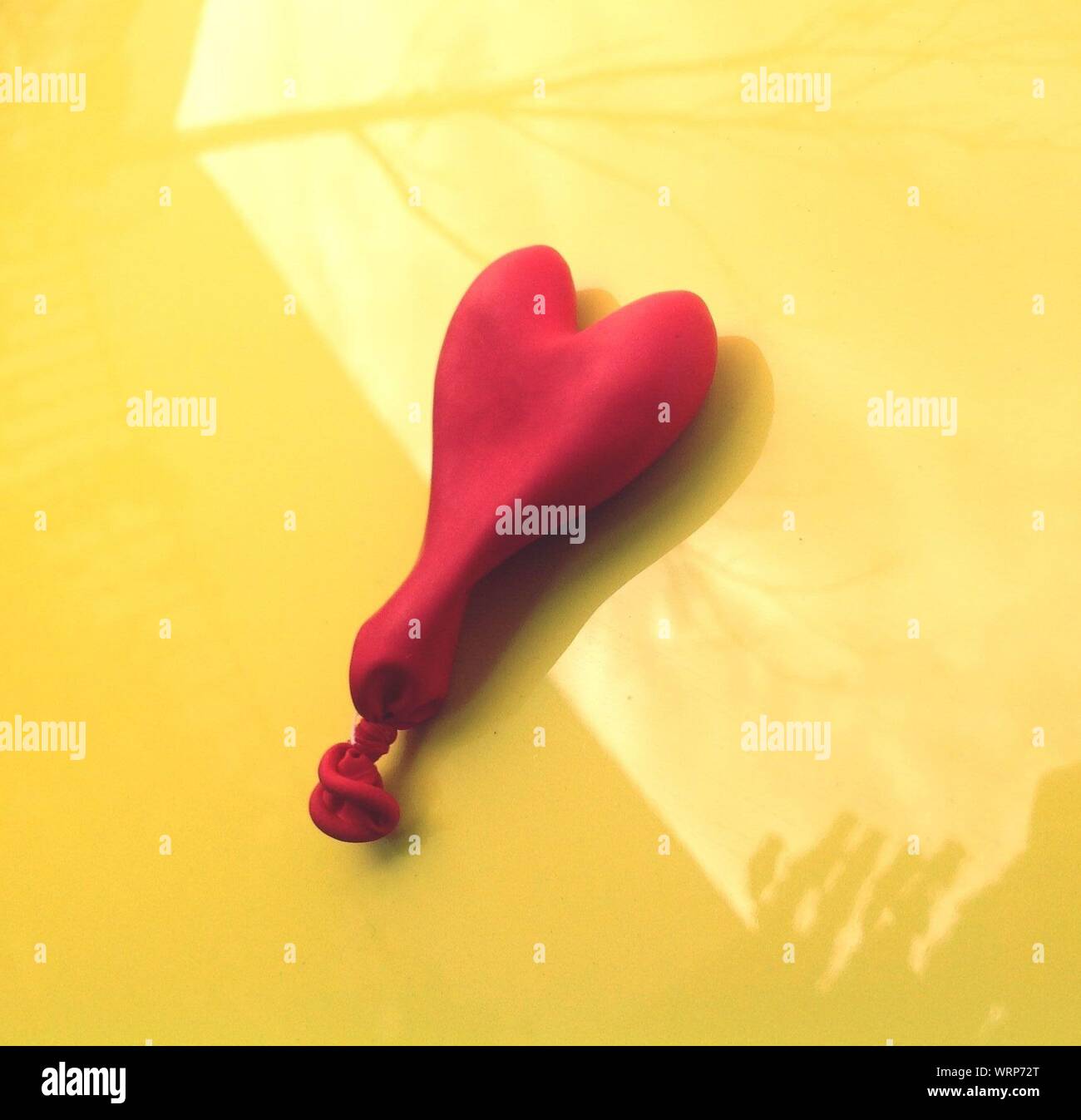 Red balloon deflated hi-res stock photography and images - Alamy