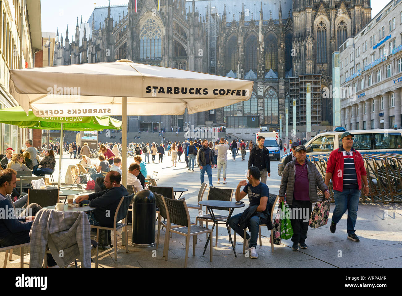 COLOGNE, GERMANY - CIRCA SEPTEMBER, 2018: people at Starbucks Coffee in ...