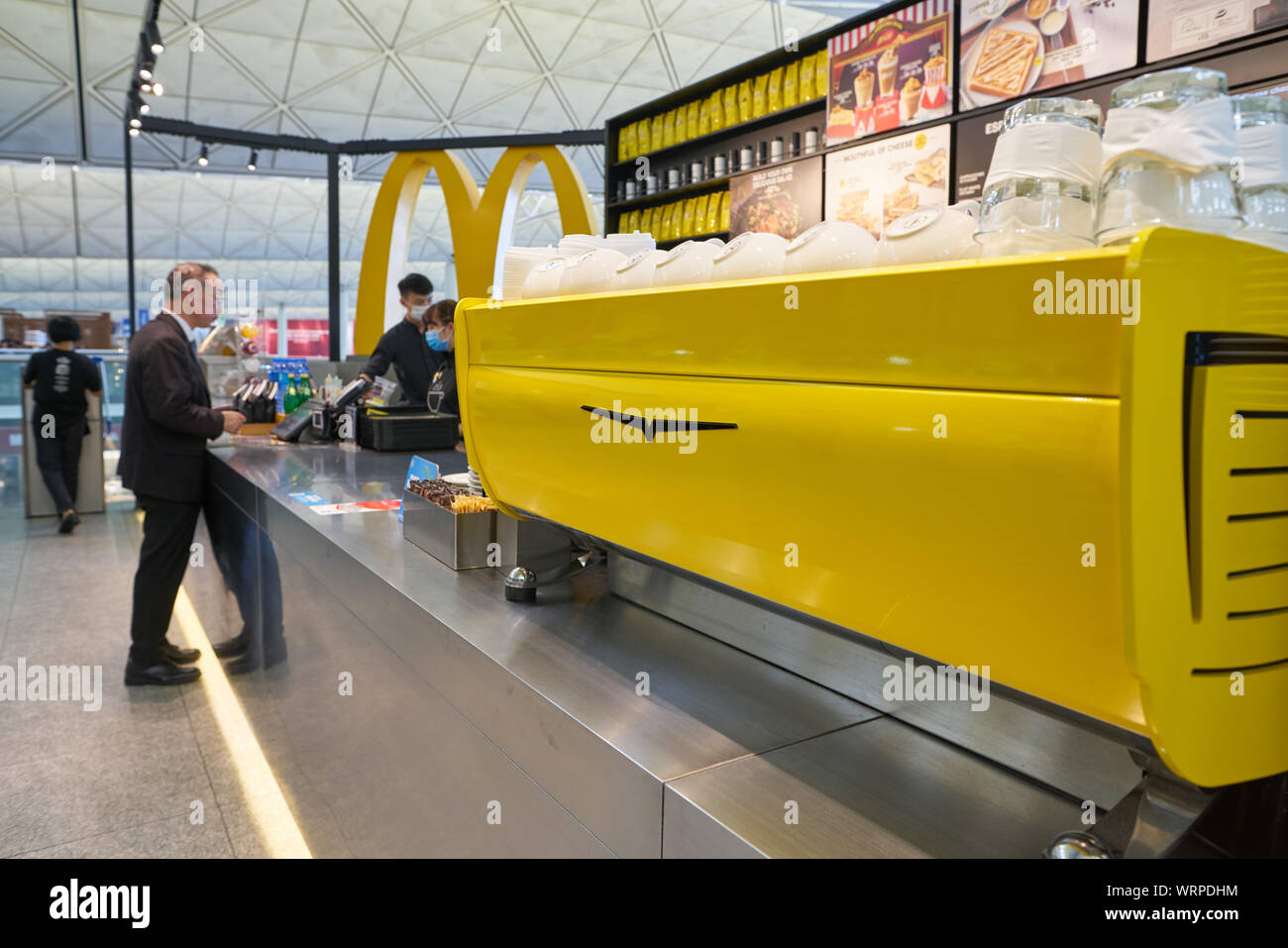 HONG KONG - CIRCA APRIL, 2019: close up shot of yellow coffee machine ...