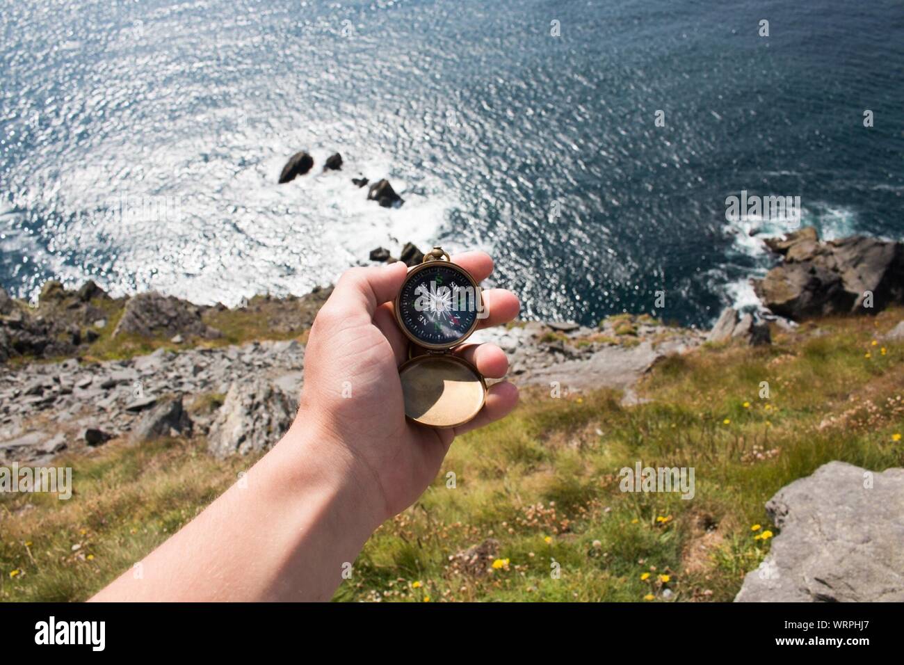 Compass hand hi-res stock photography and images - Alamy