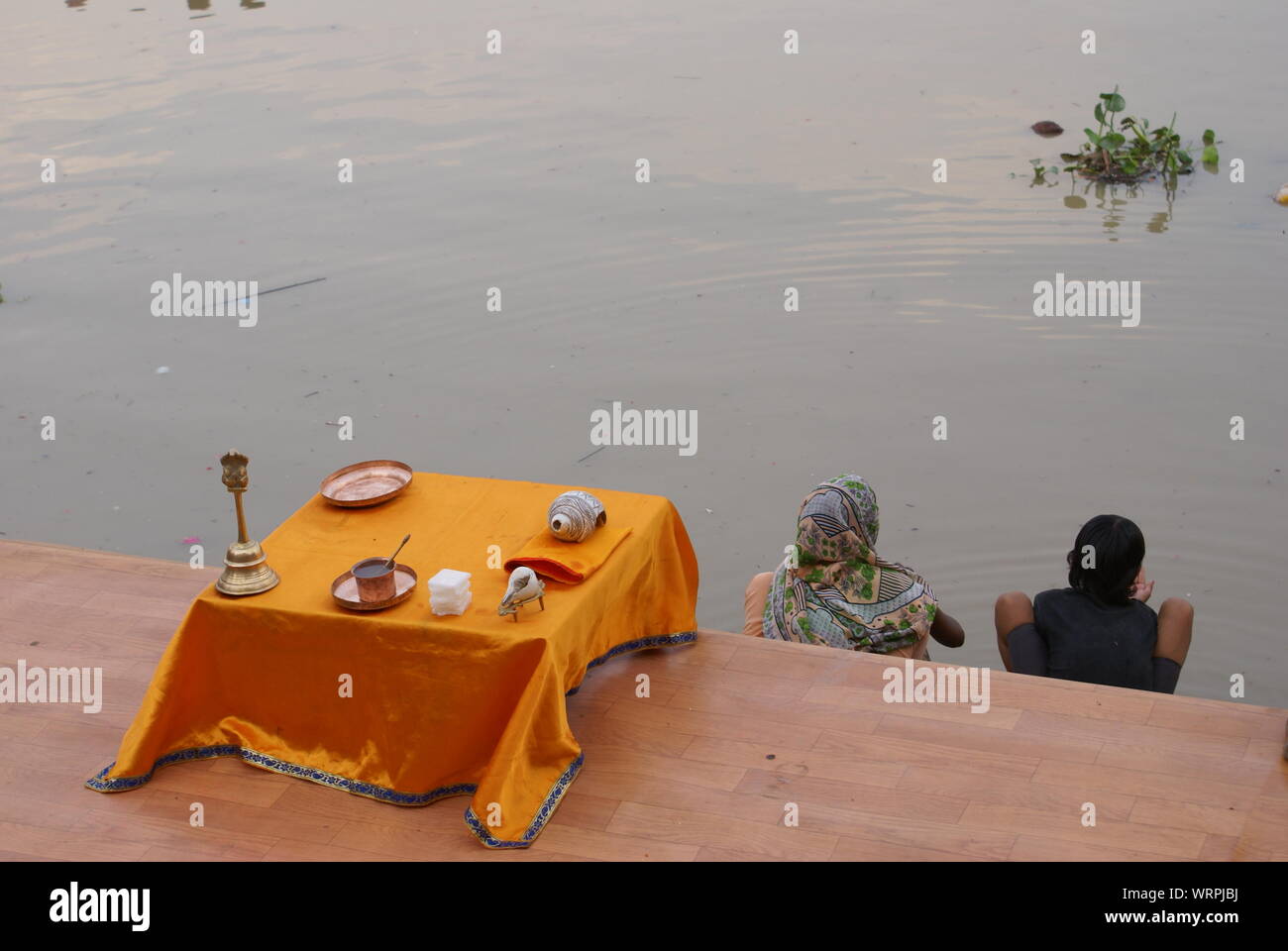 Contemplation, meditation and prayer of mother and son in the holy rive ...