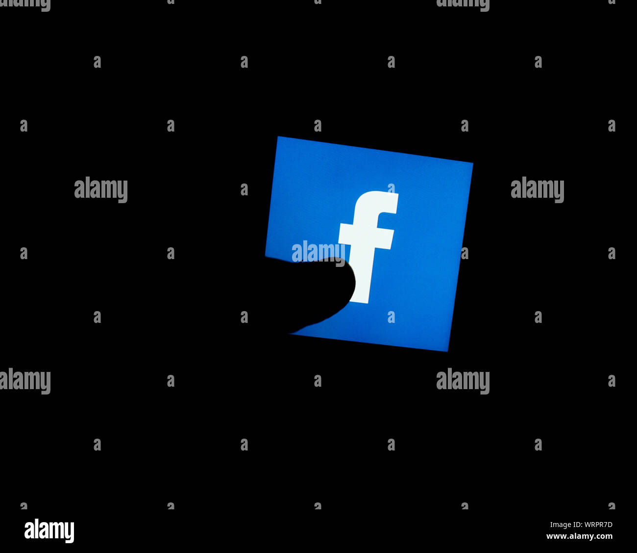 In this photo illustration, the Facebook logo is displayed on the ...