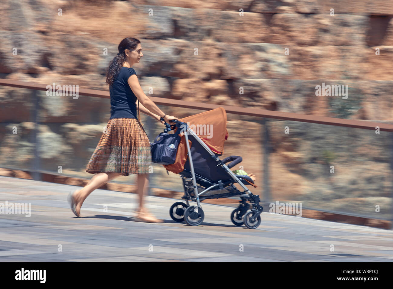 Young mother pushing baby hi-res stock photography and images - Alamy