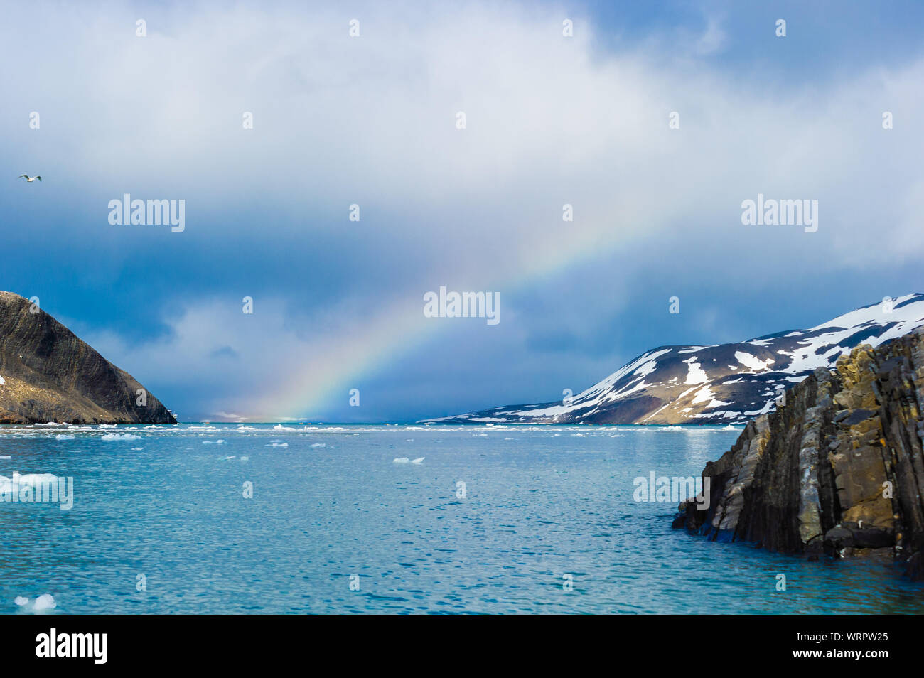 Rainbow over the Arctic Ocean in Hornsund, Svalbard, Norwasy Stock ...
