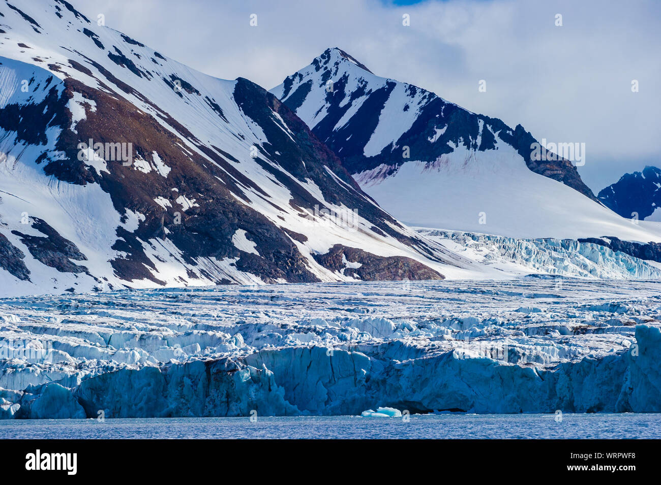 The end of a glacier in the Arctic Circle where it falls into the ...
