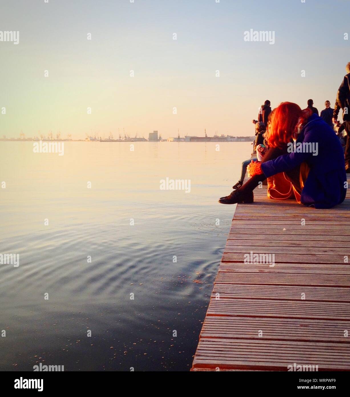 Large group of people sitting by river hi-res stock photography and ...