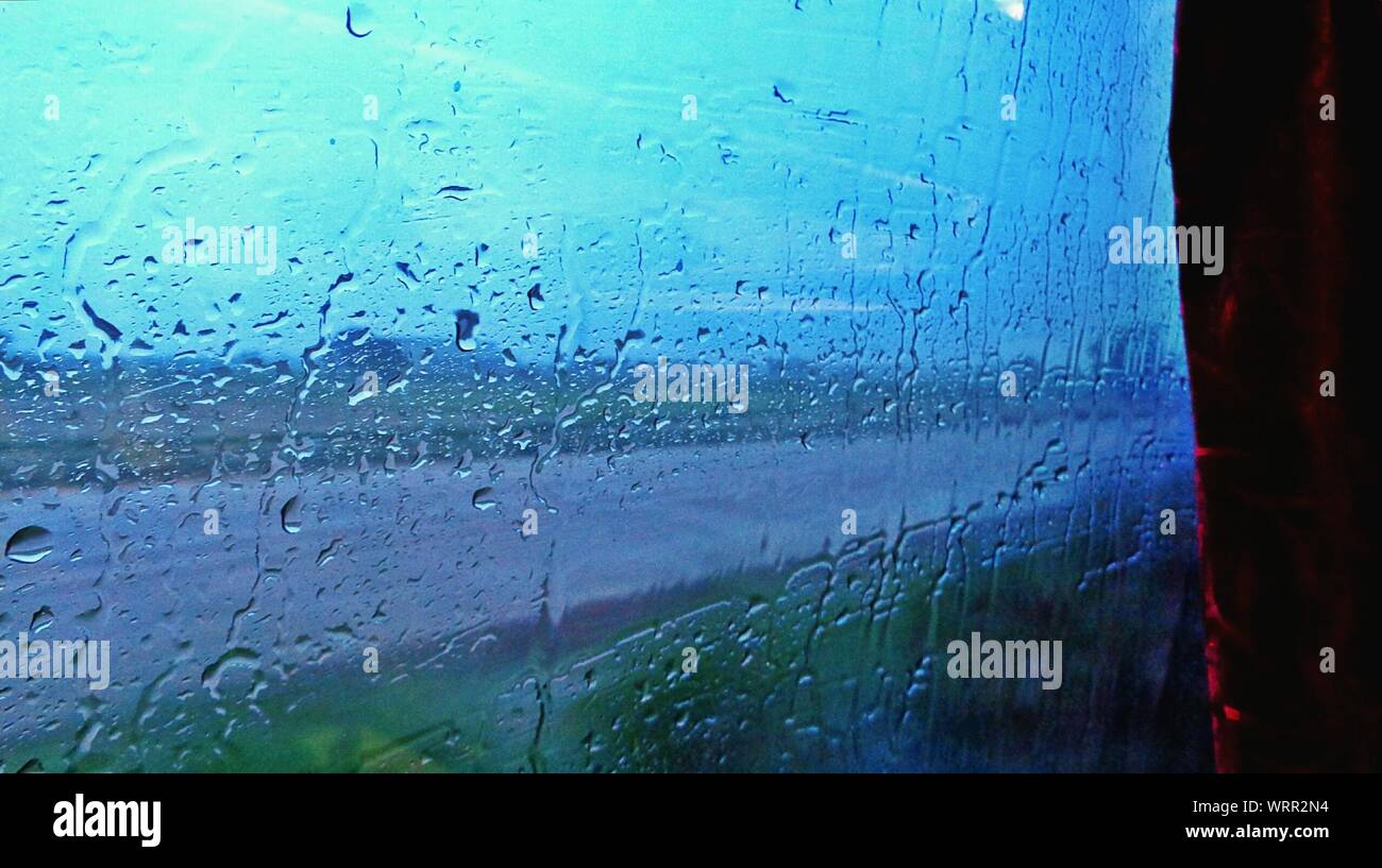 Rainy weather landscape through window hi-res stock photography and ...