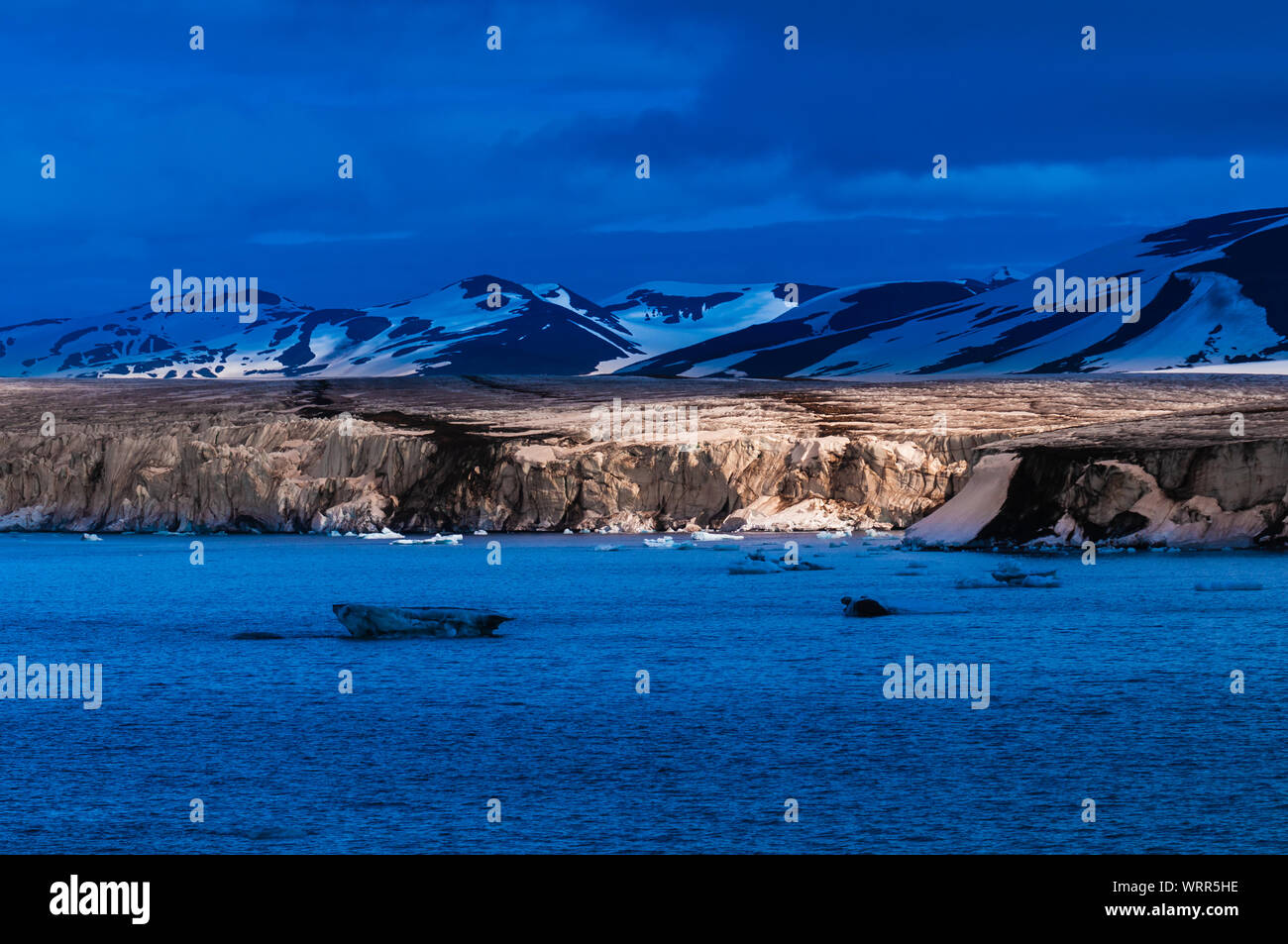 The end of a glacier in the Arctic Circle where it falls into the ...