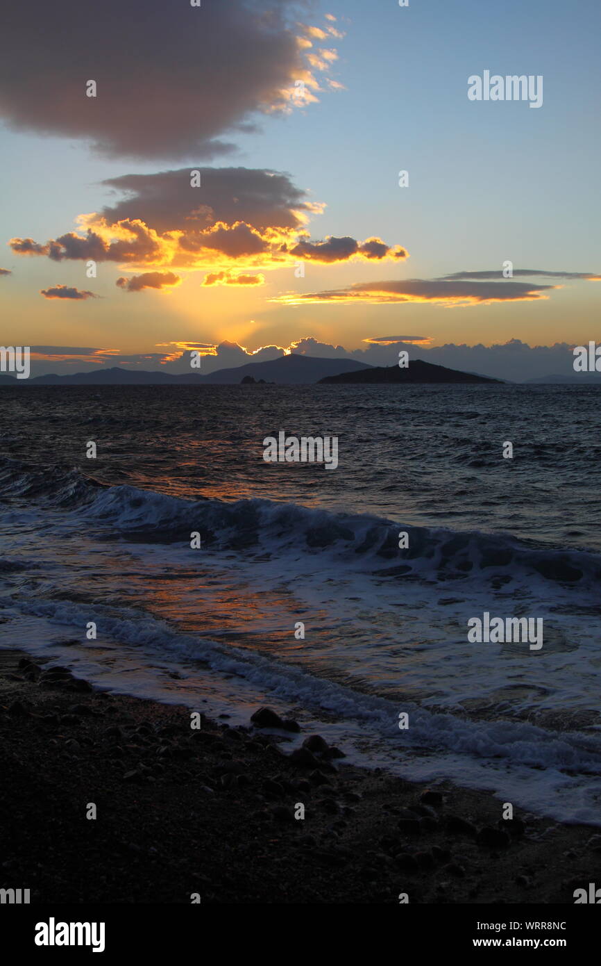 Seascape at sunset. Lighthouse on the coast. Seaside town of Turgutreis ...