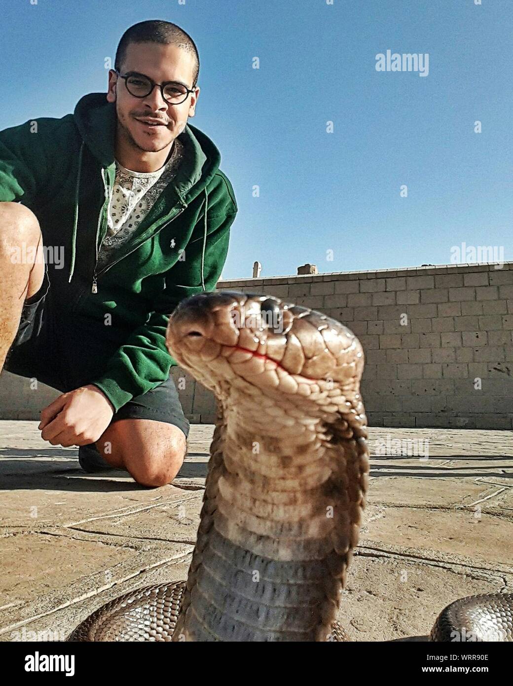 Smiling person with snake hi-res stock photography and images - Alamy