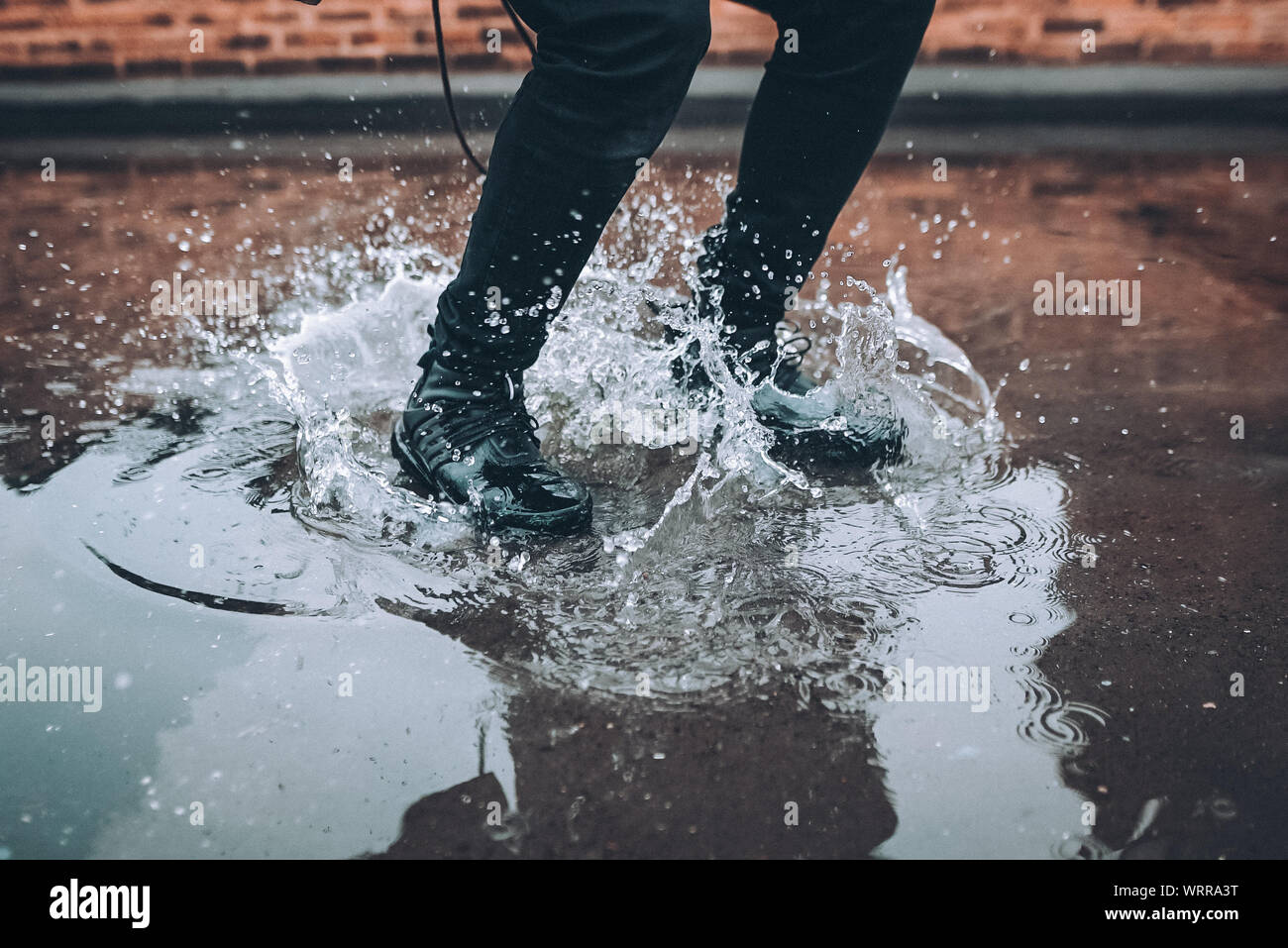Man Jumping In Puddle High Resolution Stock Photography and Images - Alamy
