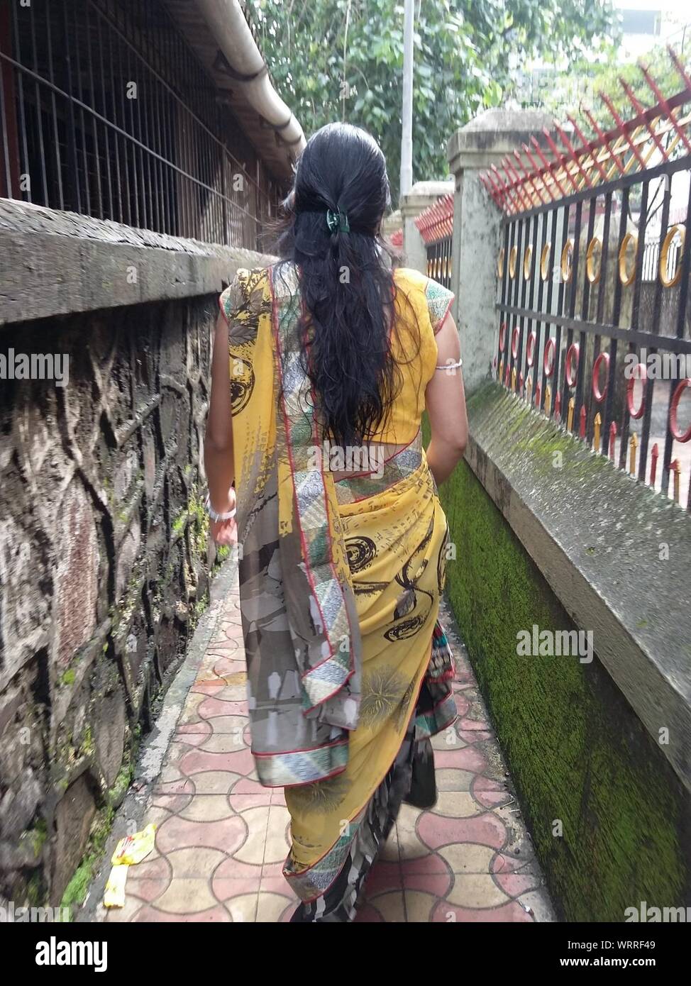 Indian Woman In Sari Walking High Resolution Stock Photography and ...