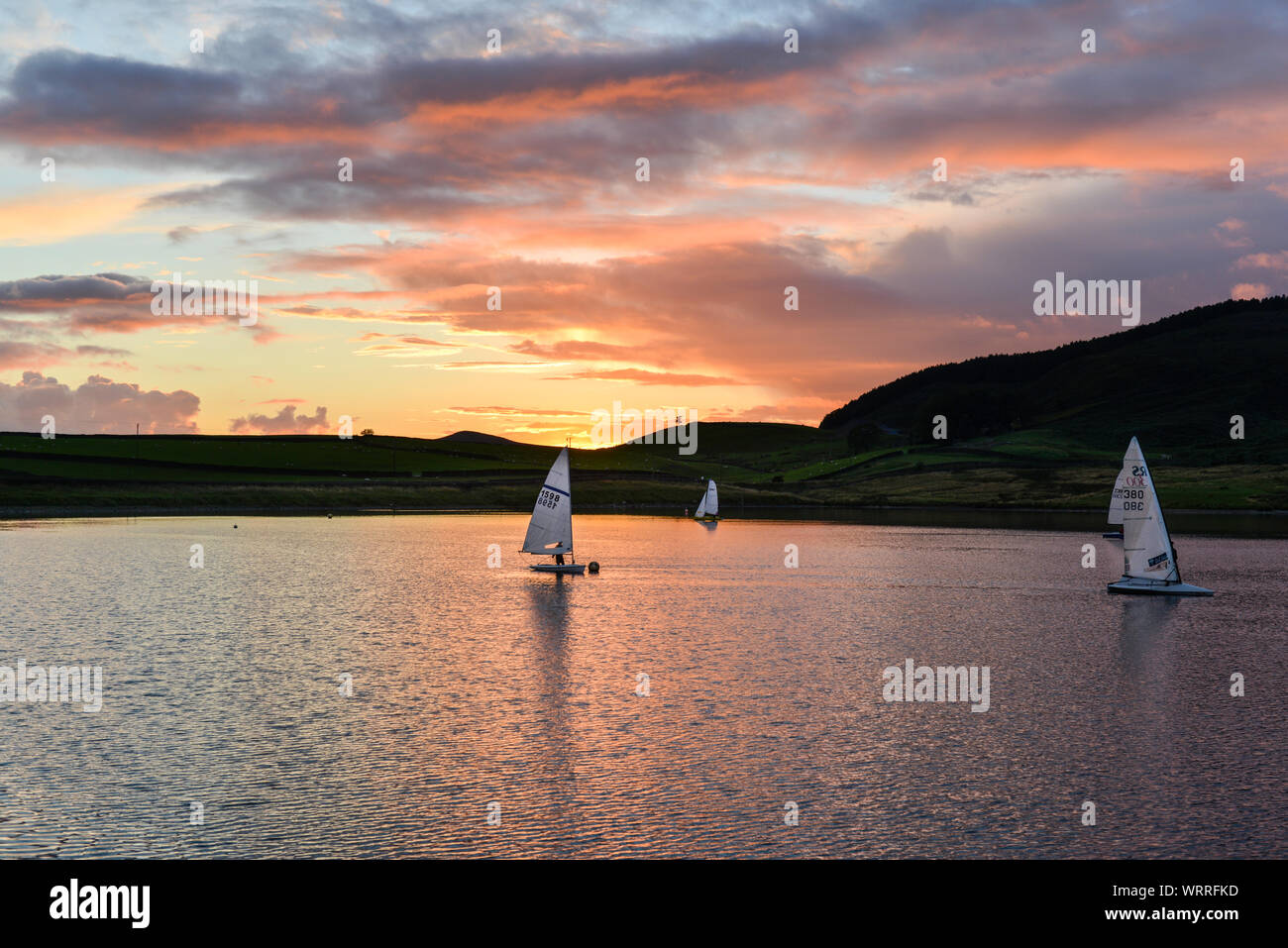 Sailing under a sunset (99 Stock Photo - Alamy