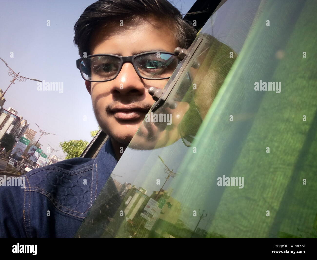 Man looking out bus window hi-res stock photography and images - Alamy