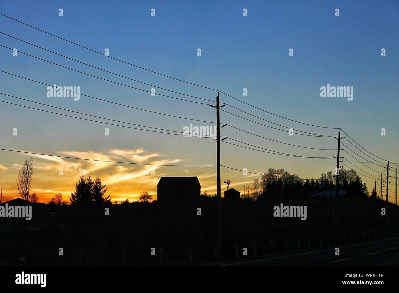 Telephone poles at sunset hi-res stock photography and images - Alamy