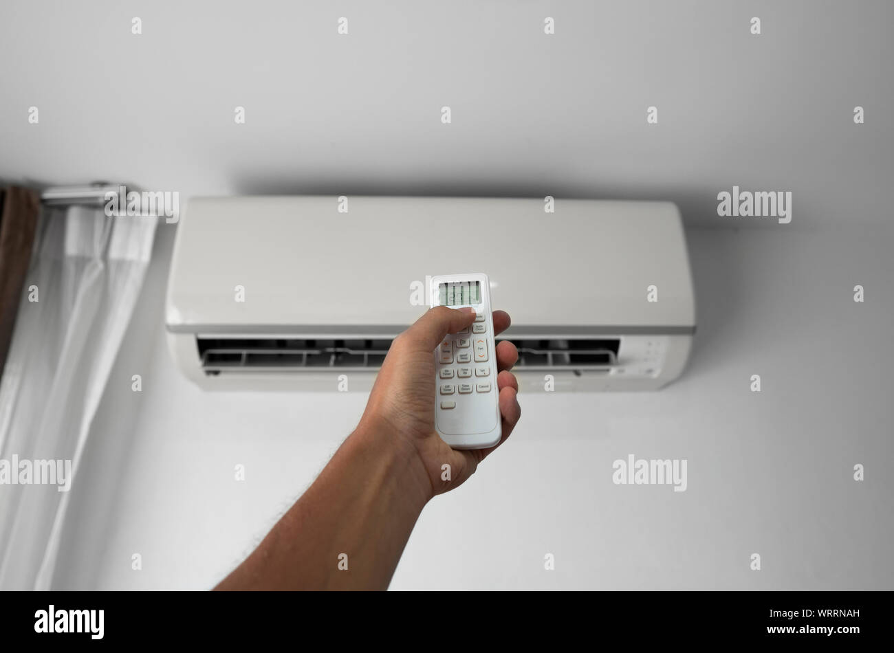 Man's hand using remote controler. Hand holding rc and adjusting ...