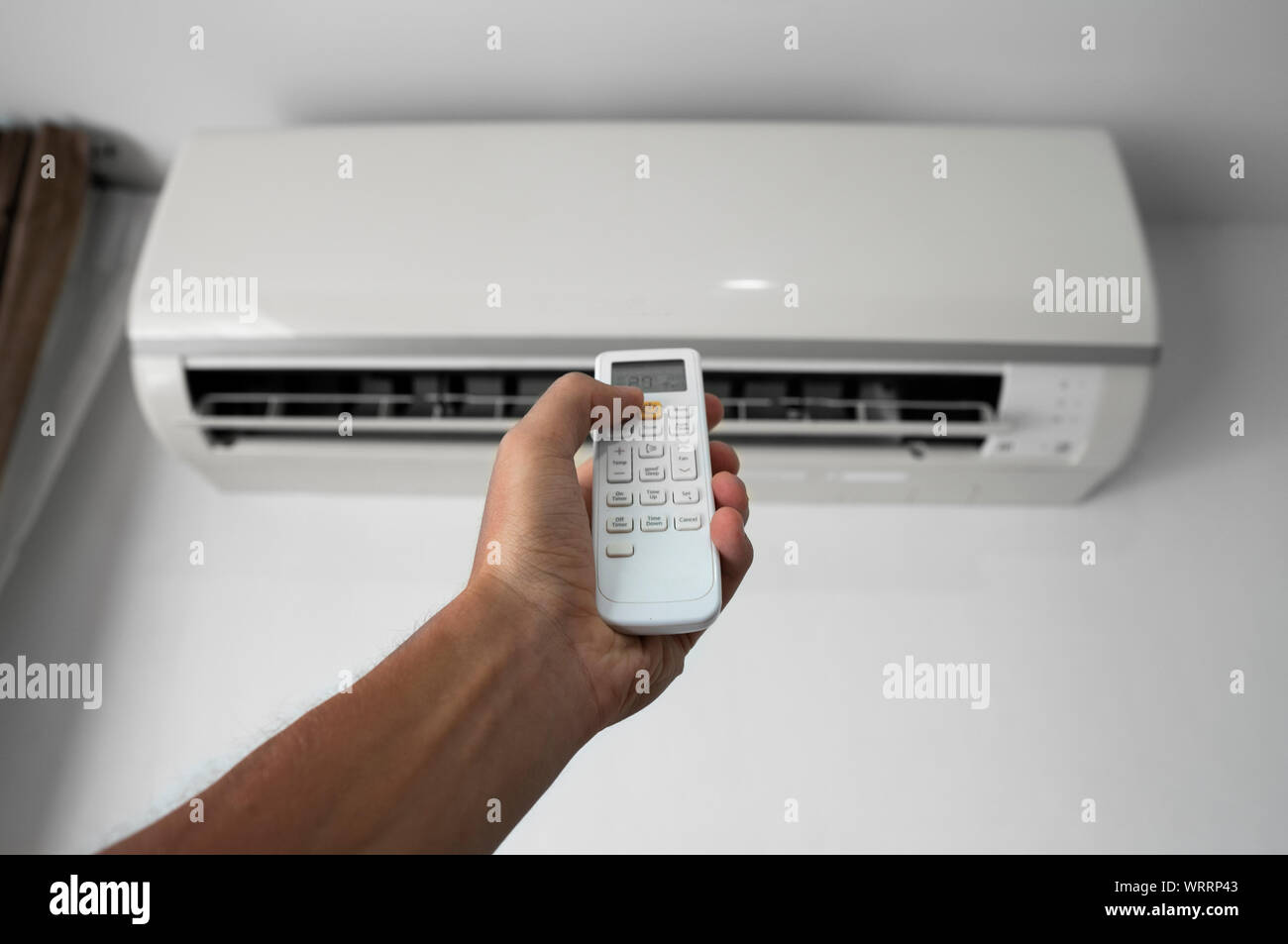 Man's hand using remote controler. Hand holding rc and adjusting ...